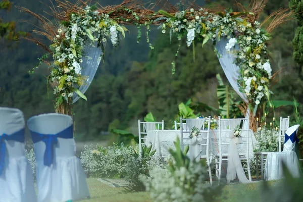 Wedding decorations. Wedding backdrop with flowers and Indonesian ...