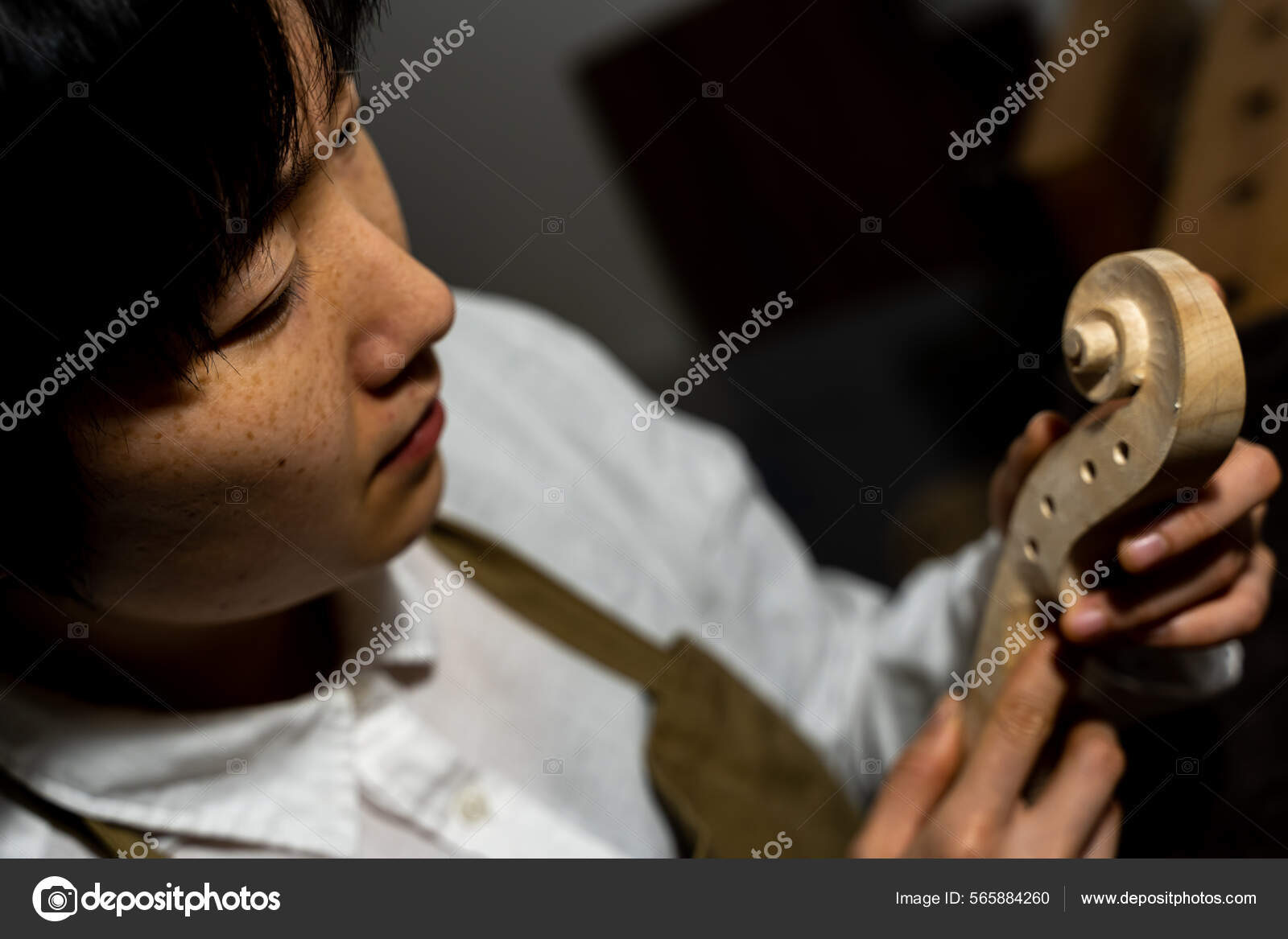 Young Chinese Female Violin Maker Working Gouge Making New Violin Stock ...