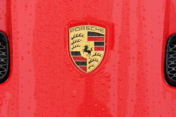 Dortmund, Germany - 09 11 2022 closeup of porsche logo on red sports ...