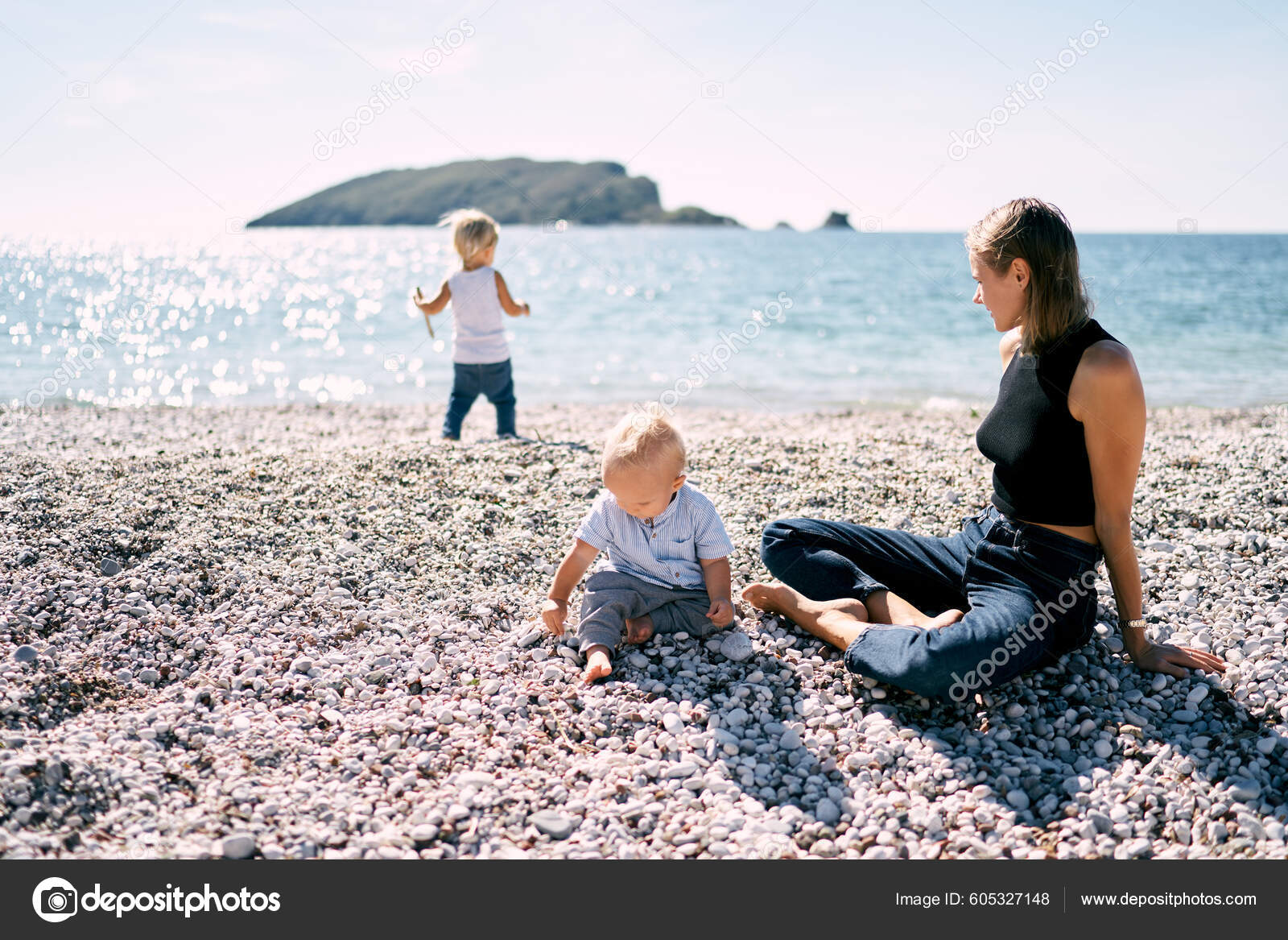 Little Boy Sorting Pebbles While Sitting His Mother Pebble Beach Stock ...
