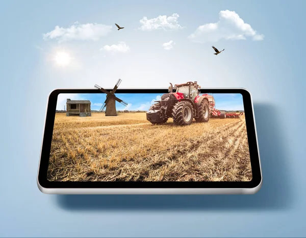 3d illustration of farm land with tractor on floating tablet screen ...