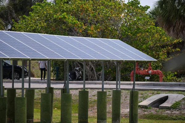 Solar panels installed on stand frame near parking lot for effective ...