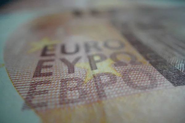 This close-up photos of a ten euros bill, focuses on a detail: euro ...