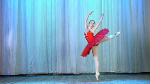 ballet rehearsal, on the stage of the old theater hall. Young ballerina ...