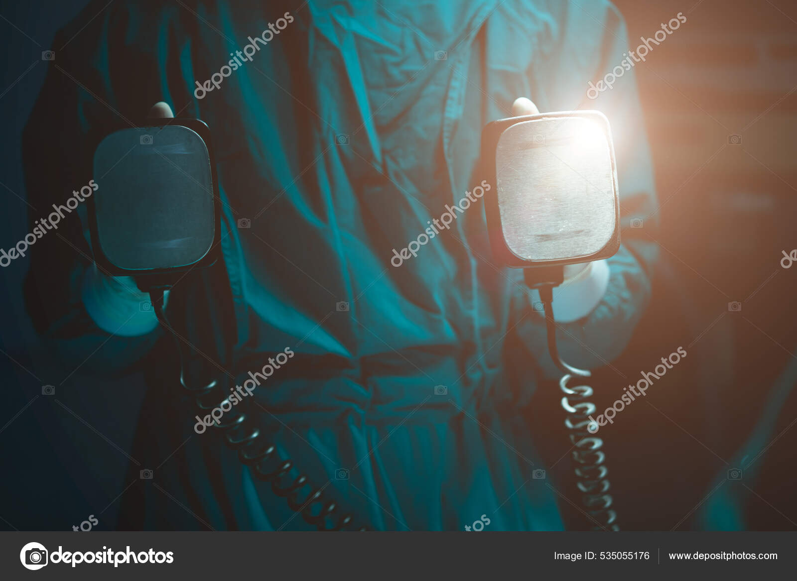 Doctor Holding Manual Defibrillator Pulse Generator Operating Room ...