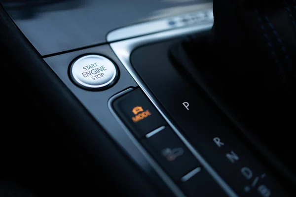 Start-stop buttons on modern cars selective focus. Silver start and ...