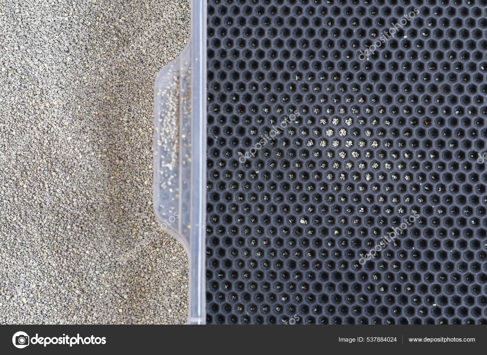 A litter box with clumping litter sits on a honeycomb EVA mat. Small ...