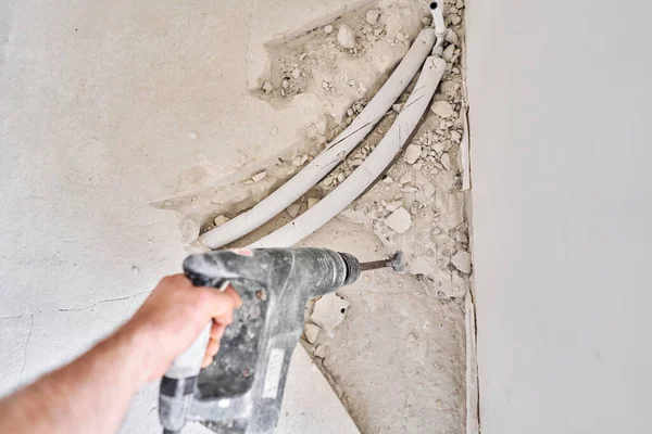 connection heating pipes to white Radiator in a new apartment under ...