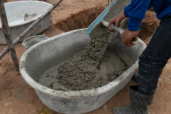 Cement mixed with stone Pour it onto a mortar mixing truck. That is ...