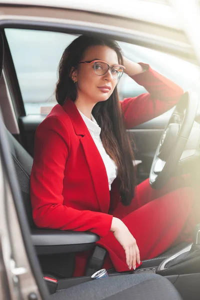 Attractive brunette in the car. Lady driving. - Stock Image - Everypixel