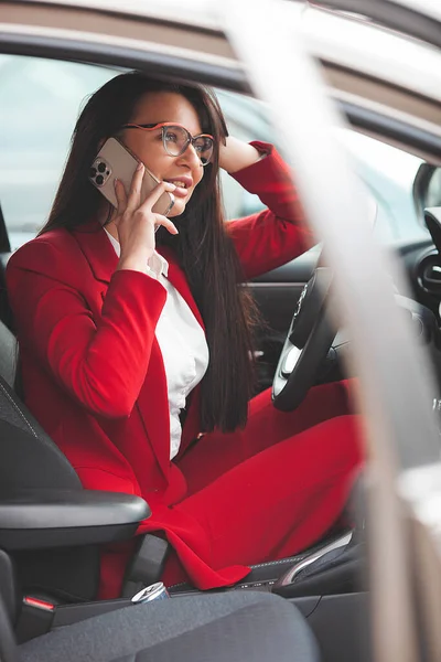 Attractive brunette in the car. Lady driving. - Stock Image - Everypixel