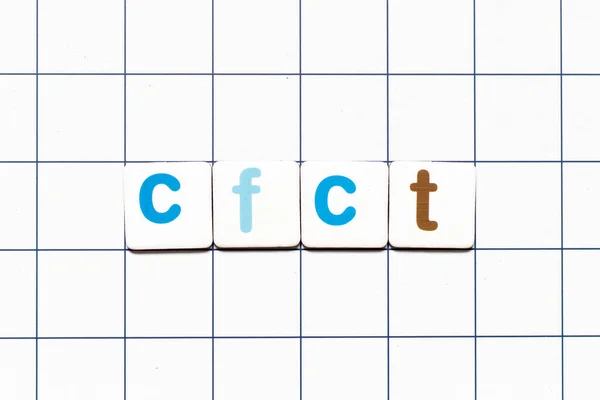 Colorful tile letter in word CFCT (Abbreviation of Cash Flow Cycle Time) on white grid ...