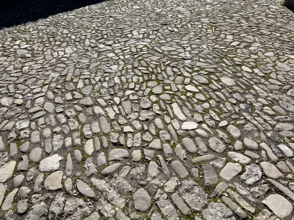 medieval road pavement with river stones. High quality photo - Stock ...