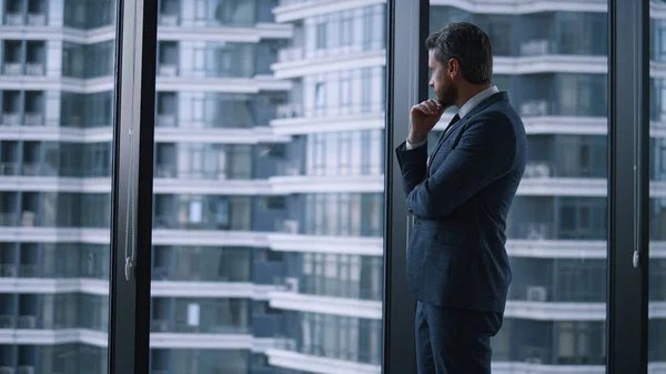 Boss man standing alone crossing hands thinking career in corporate ...