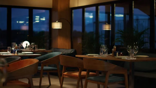 Alone woman sitting at restaurant in evening big city. Beautiful lady ...