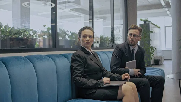 Distressed employees waiting for meeting with strict company boss ...