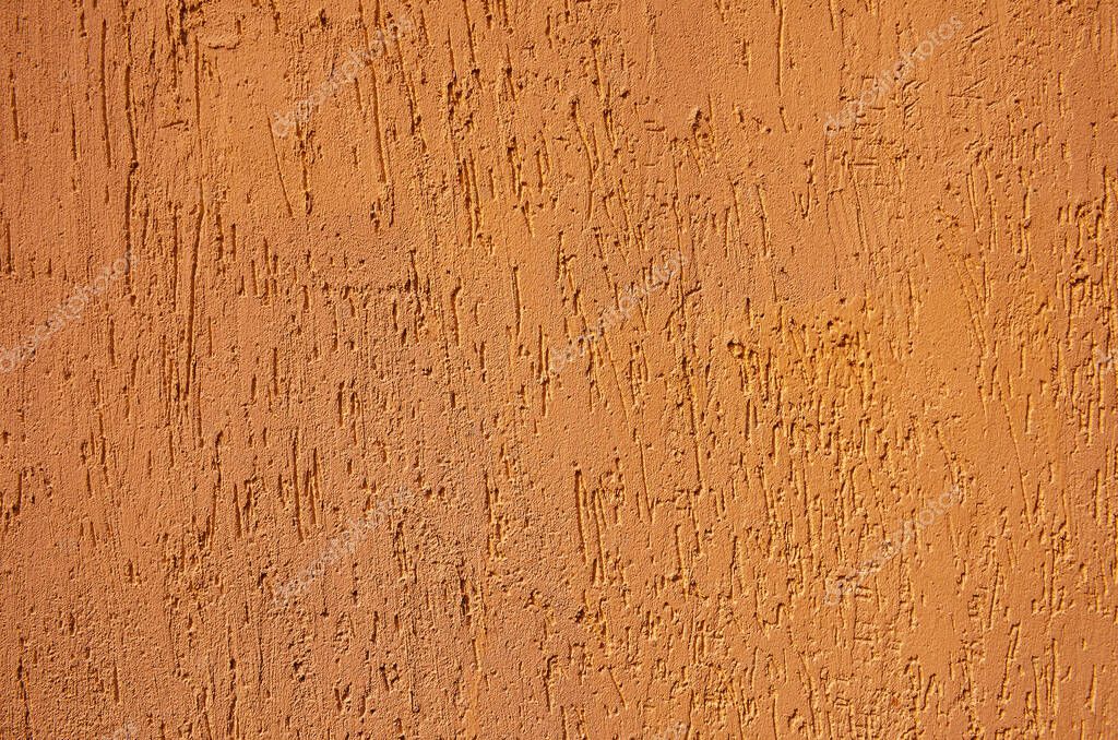Una textura de una pared enlucida en color naranja. Fondo abstracto ...