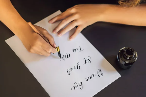 Dream big set goals take action. Calligrapher Young Woman writes phrase ...