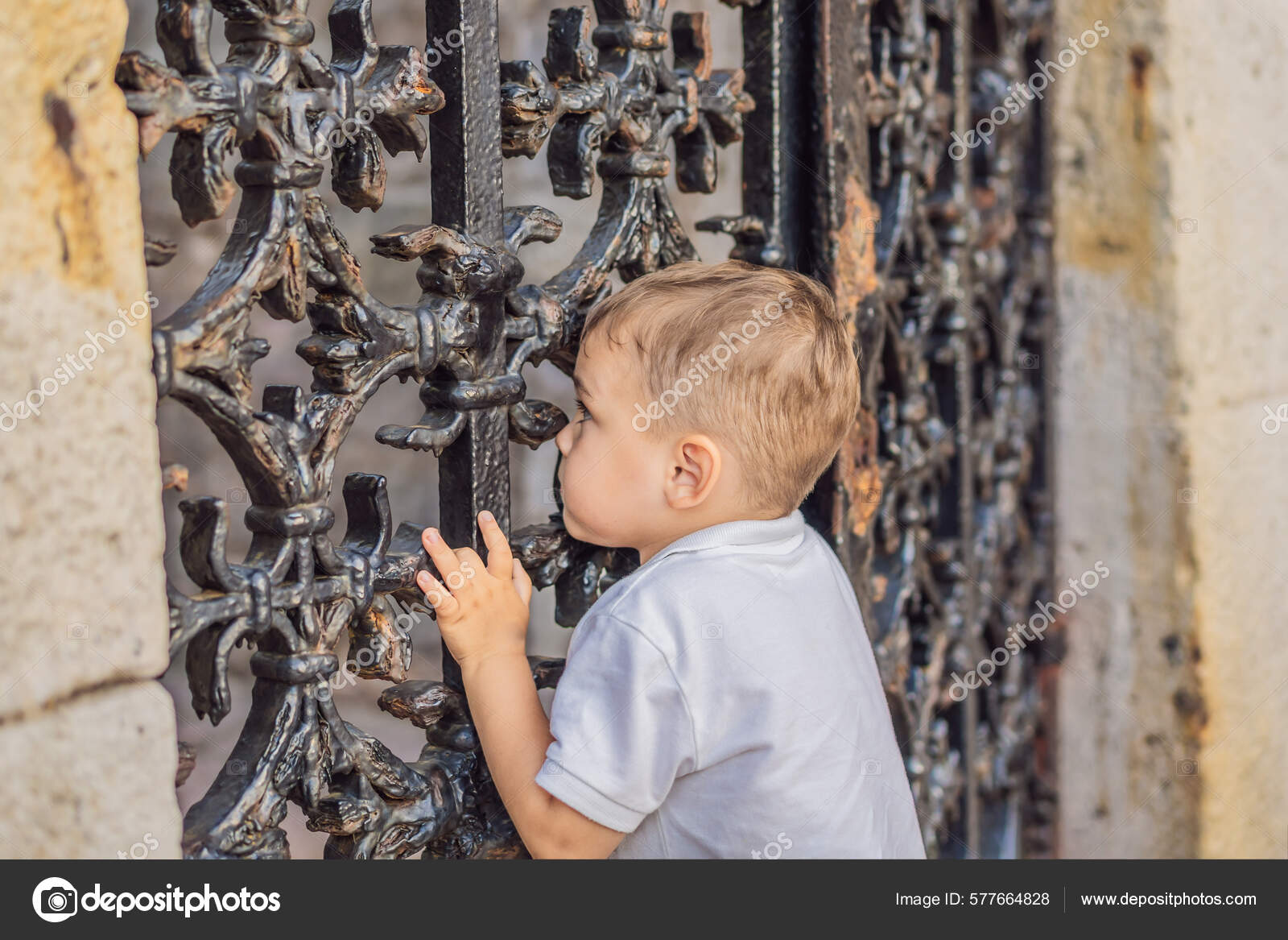 Boy Peeking Hole Fence Stock Photo by ©galitskaya 577664828