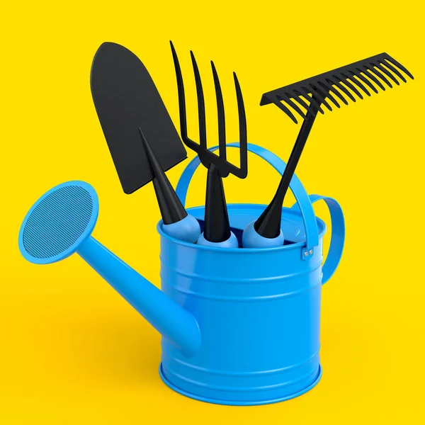 Watering can with garden tools like shovel, rake and fork on yellow ...