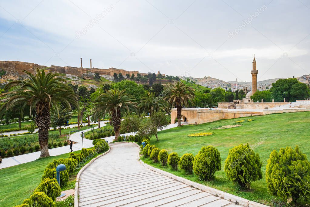 Sanliurfa old town view around popular Balklgl, fish lake, area with Urfa castle at the top ...
