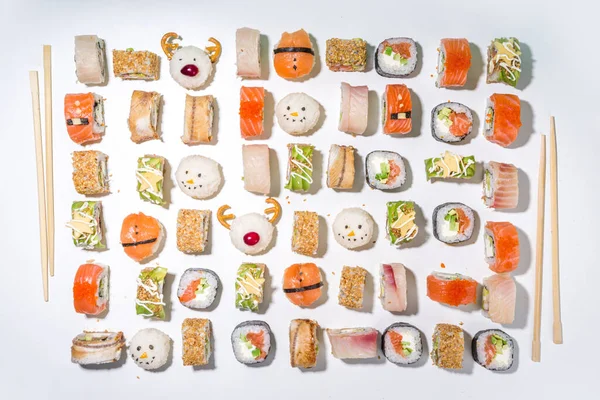 Christmas sushi set with funny decorated rolls like Xmas symbols santa ...