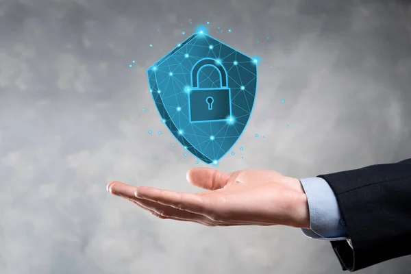 Businessman hold low poly polygon shield with a padlock icon.Secure Access System Concept ...