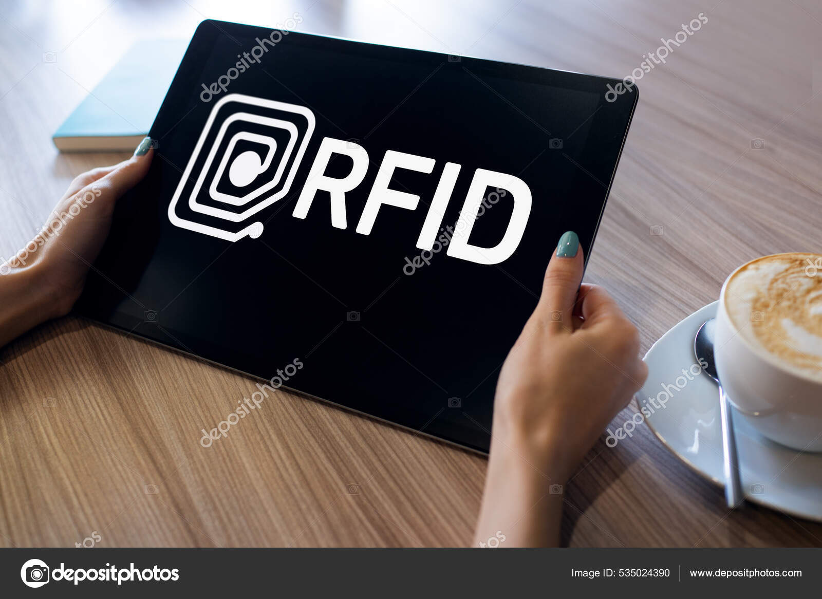 RFID Radio frequency identification technology concept on device screen ...