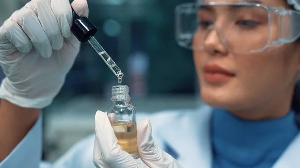 Scientist test CBD hemp oil product in curative CBD lab . The hemp oil ...