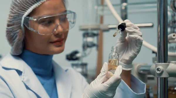 Scientist test CBD hemp oil product in curative CBD lab . The hemp oil ...